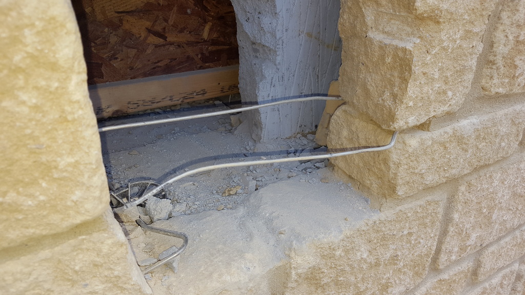 Continuous rod embedded between brick courses?